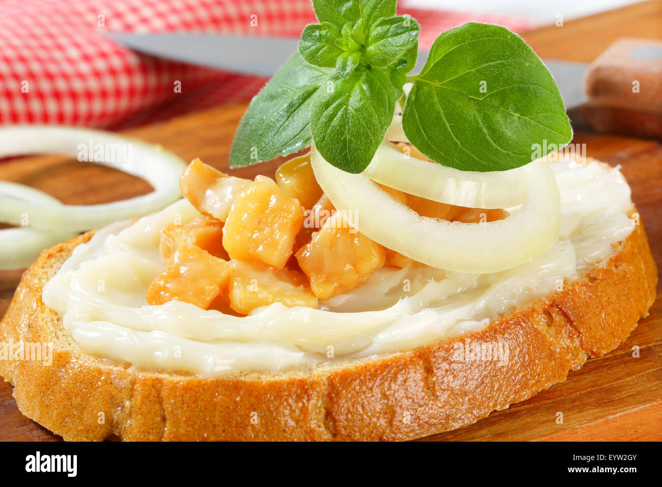Slice of bread spread with lard and greaves Stock Photo - Alamy