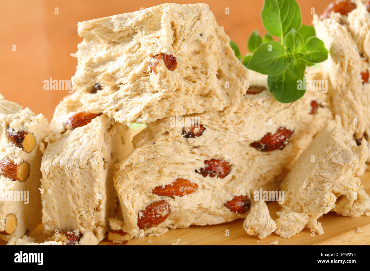 Pieces of Greek halva with almonds Stock Photo - Alamy