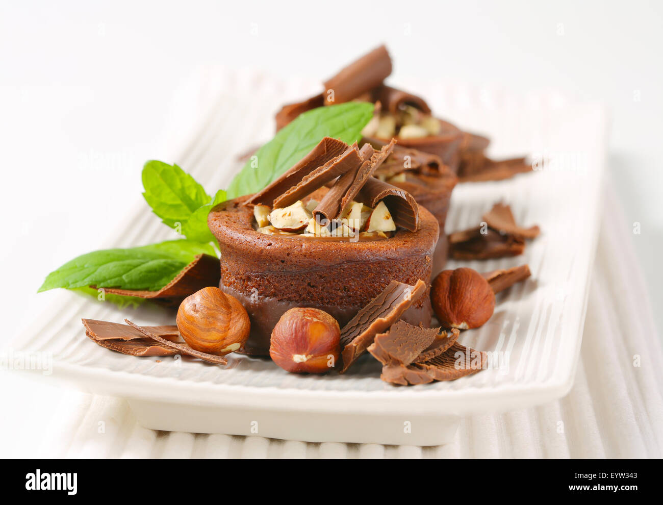 Mini chocolate cakes with hazelnut filling Stock Photo - Alamy