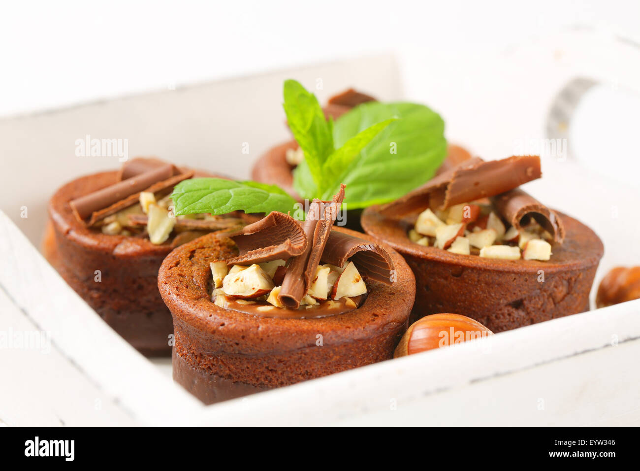 Mini chocolate cakes with hazelnut filling Stock Photo - Alamy