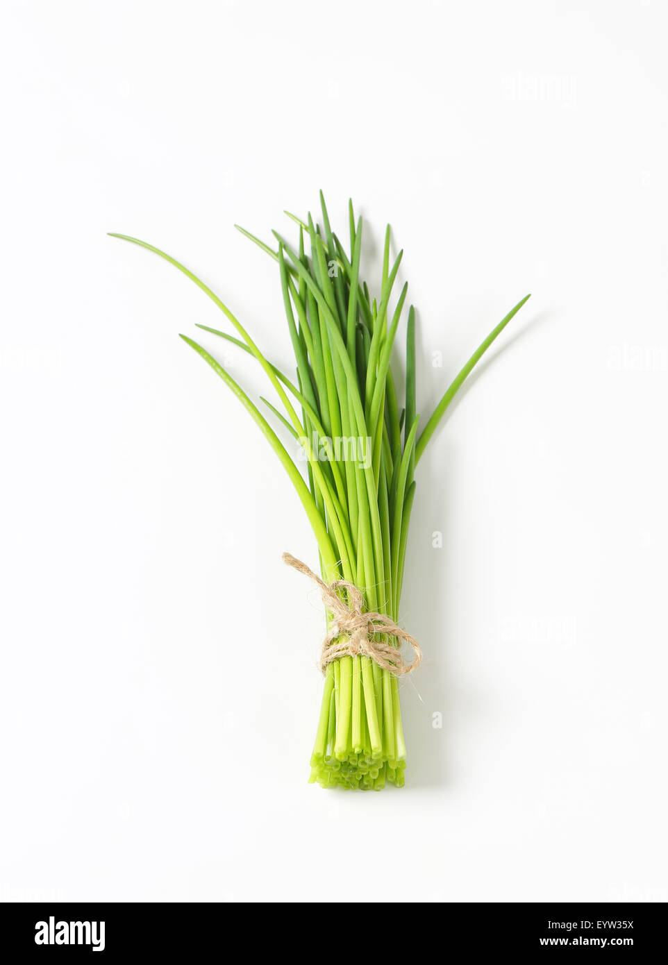 Bunch of fresh chives on white background Stock Photo - Alamy