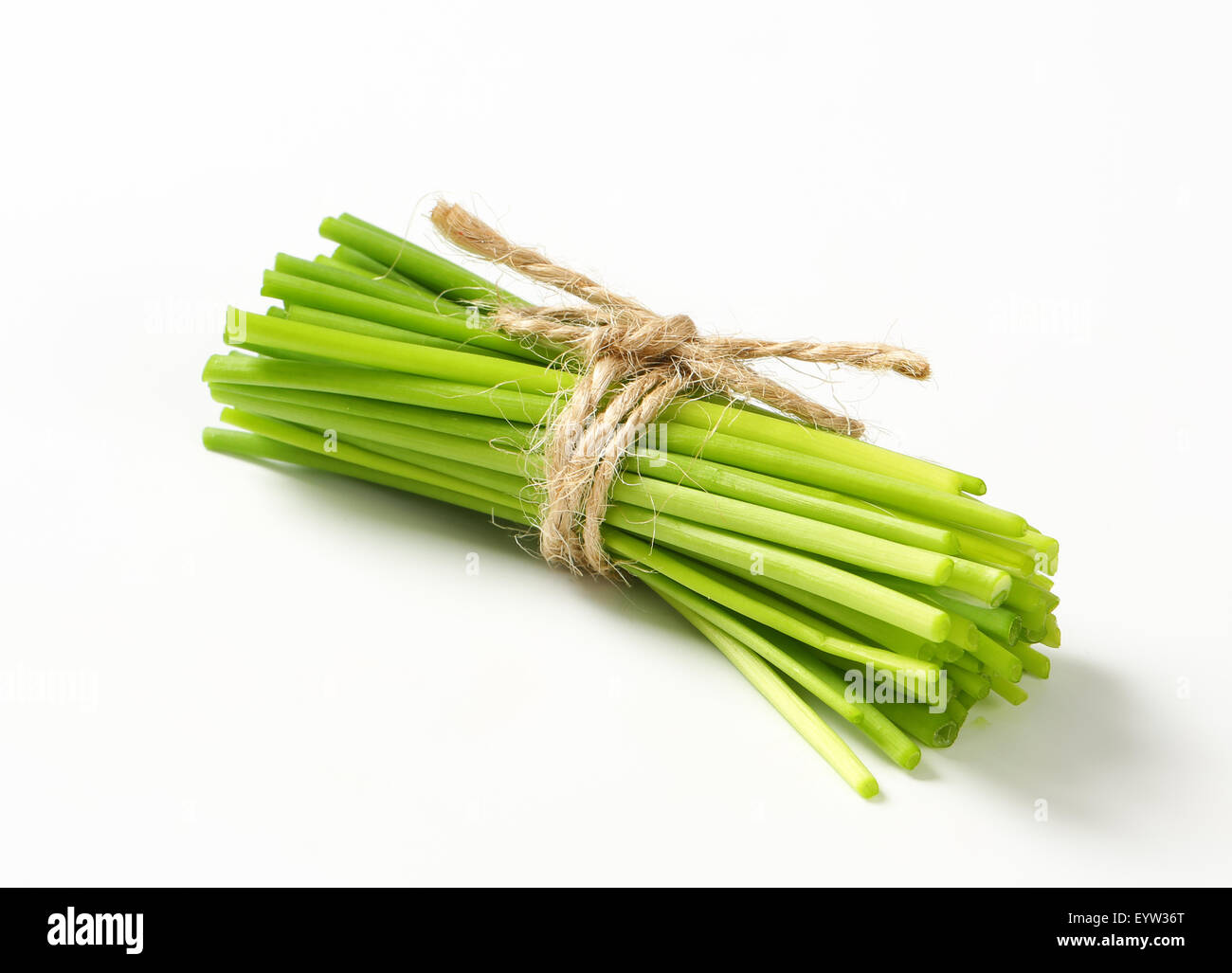 Bunch of fresh chives on white background Stock Photo - Alamy