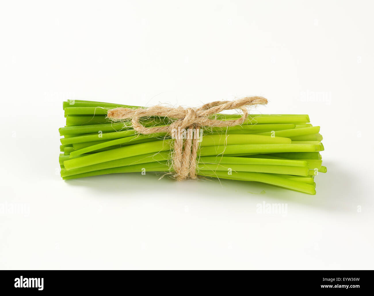 Bunch of fresh chives on white background Stock Photo - Alamy