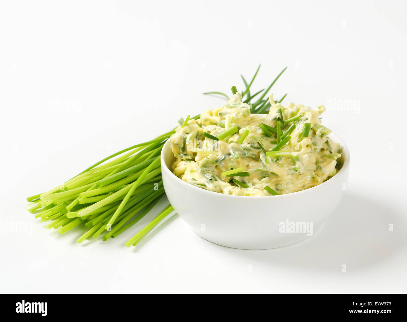 Bowl of homemade chive butter Stock Photo - Alamy