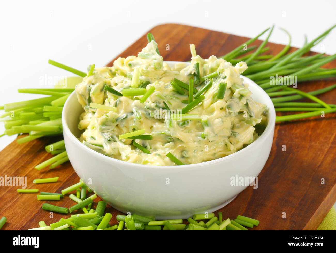 Bowl of homemade chive butter Stock Photo - Alamy