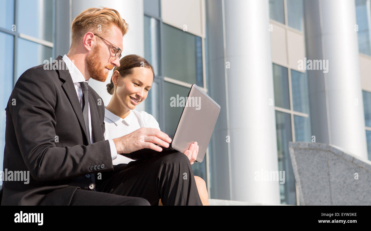 Business people with laptop Stock Photo - Alamy