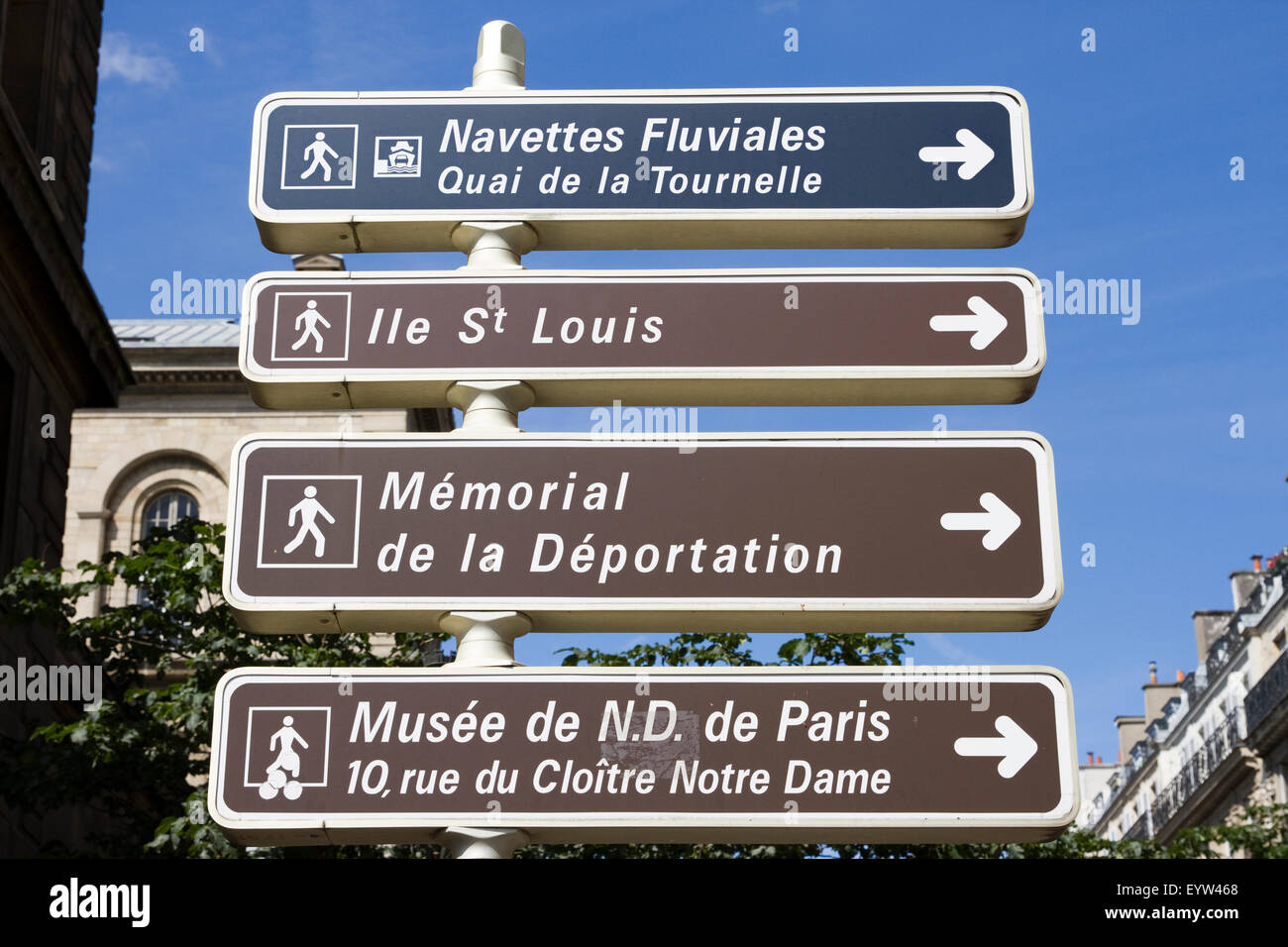 Four street signs for local sites which are located near Notre-Dame ...