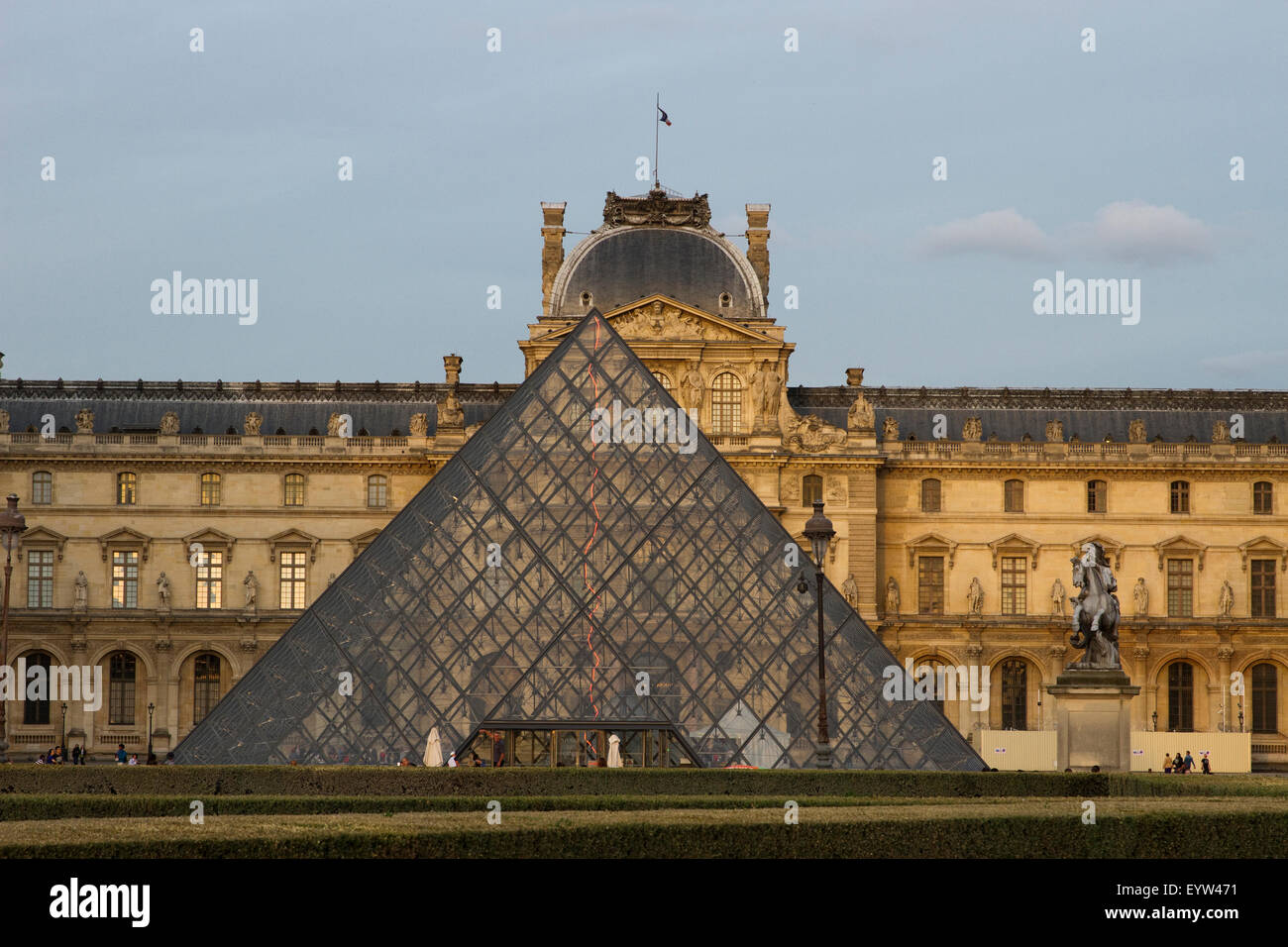 Louvre Pyramid (Pyramide du Louvre) at golden hour with Pavillon Sully ...