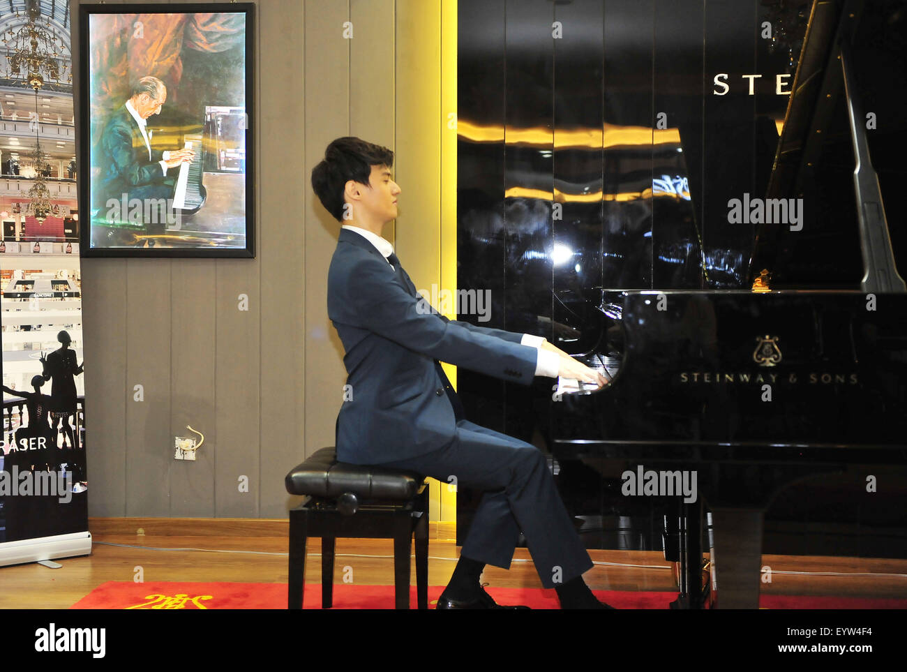 Beijing, China. 4th Aug, 2015. Pianist Zhang Haotian performs as the ...