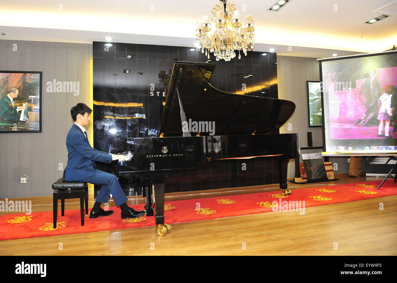 Beijing, China. 4th Aug, 2015. Pianist Zhang Haotian performs as the ...