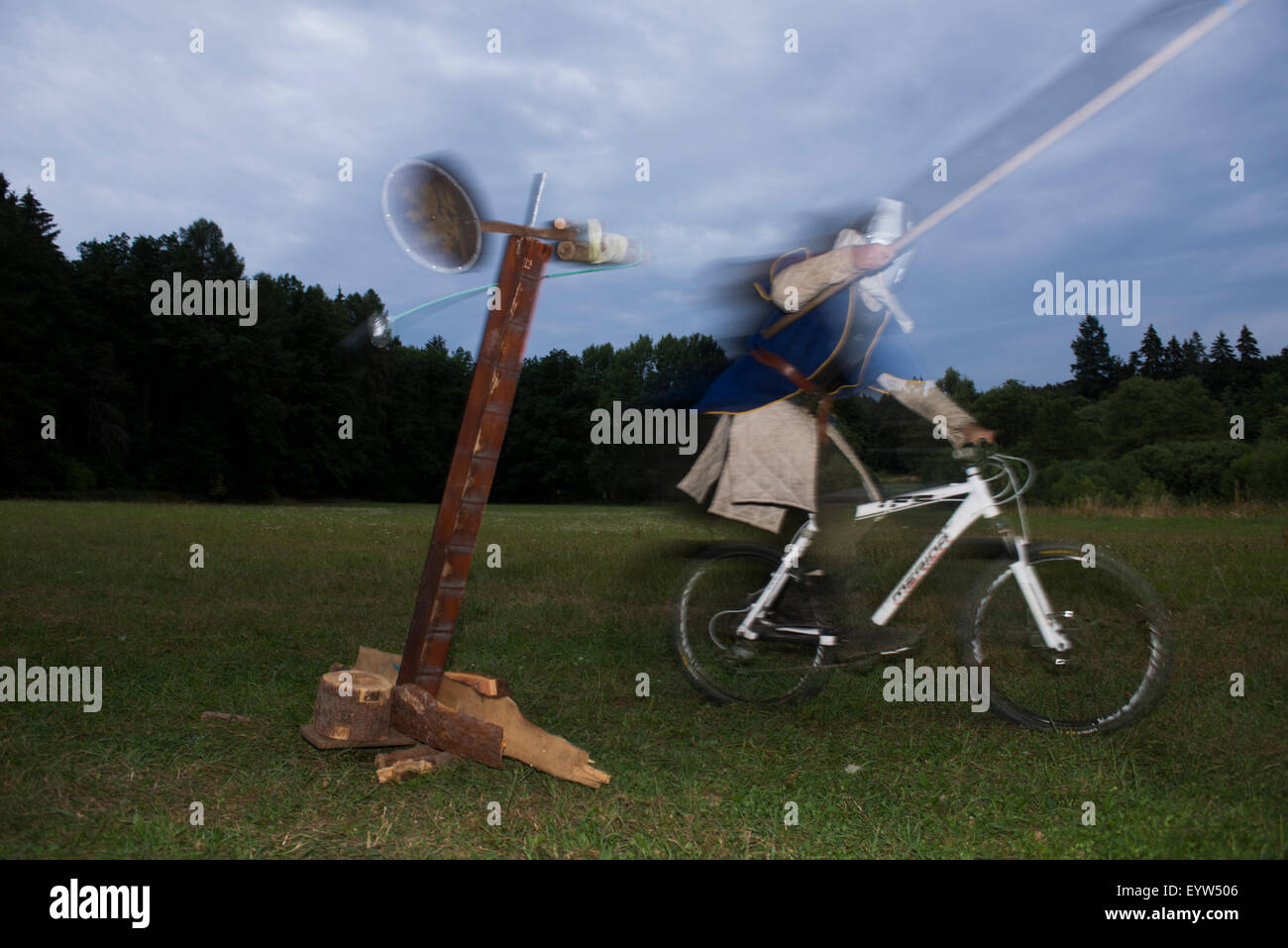 Child boy dressed as medieval knight / soldier training with spear ...