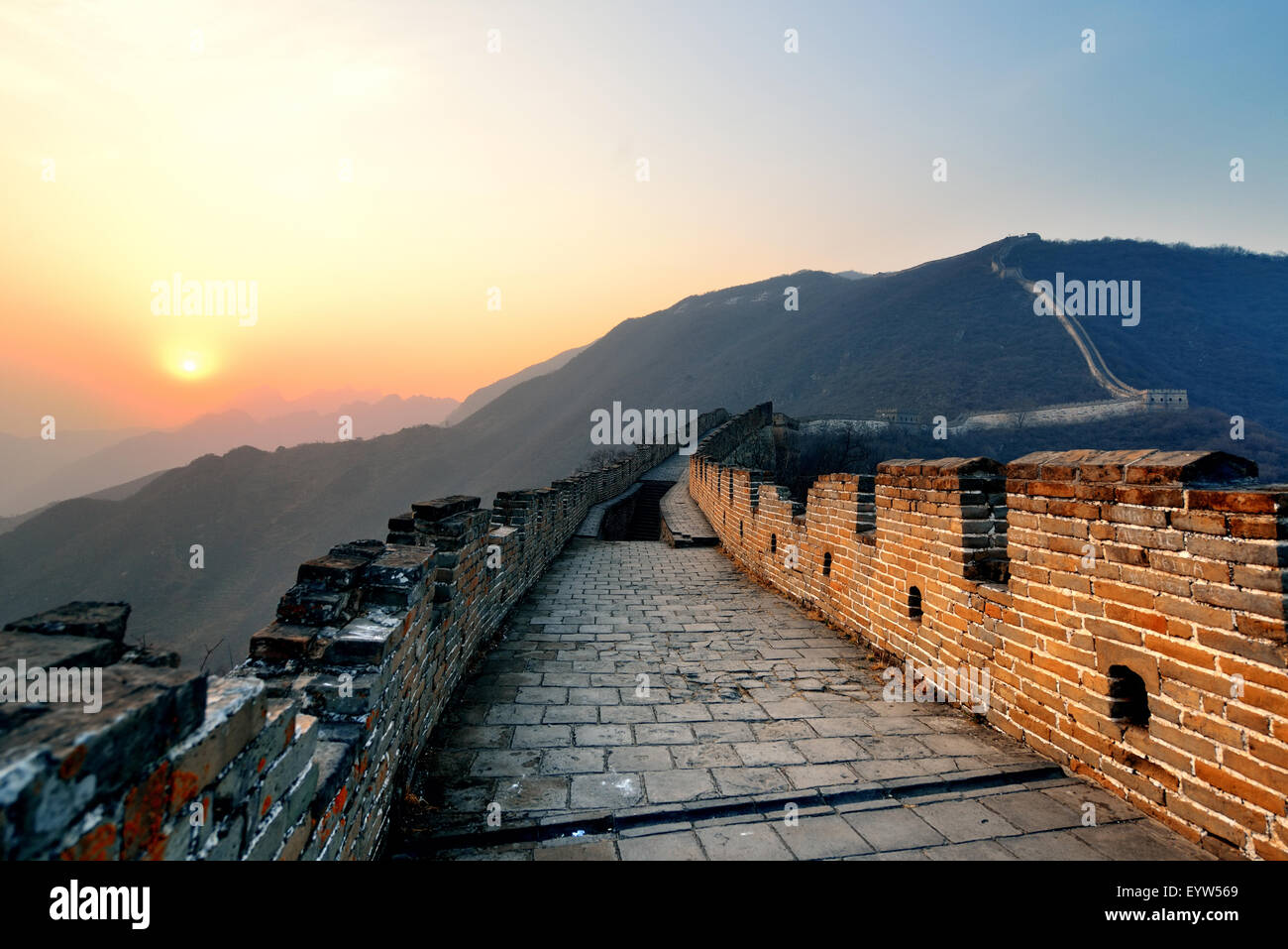 Great Wall sunset over mountains in Beijing, China Stock Photo - Alamy