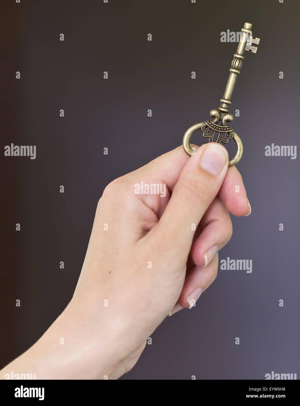hand with key Stock Photo - Alamy