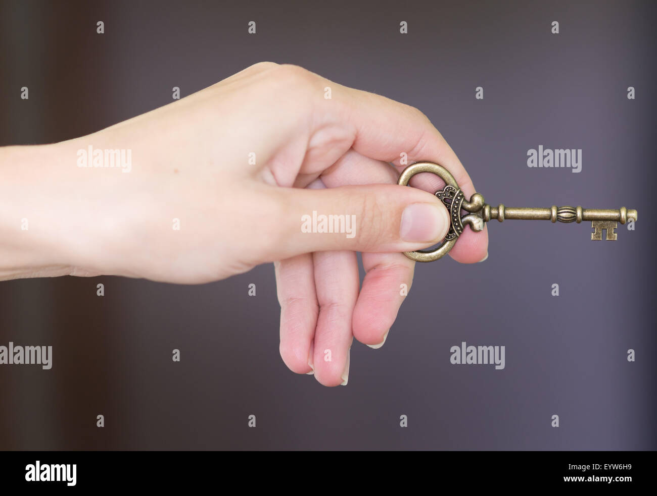 hand with key Stock Photo - Alamy