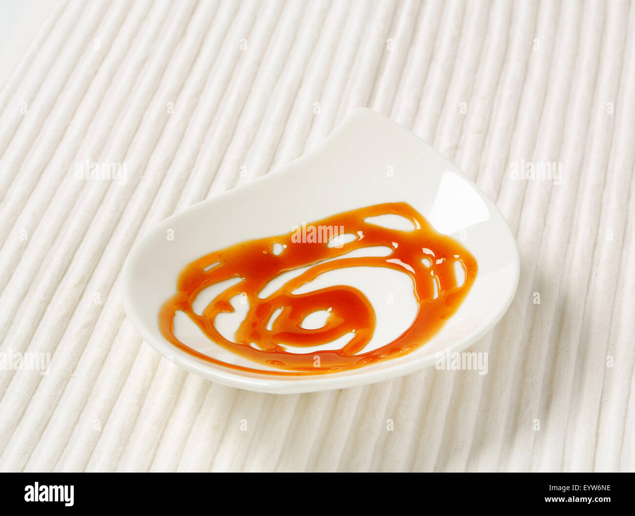 Caramel drizzle sauce on plate Stock Photo - Alamy