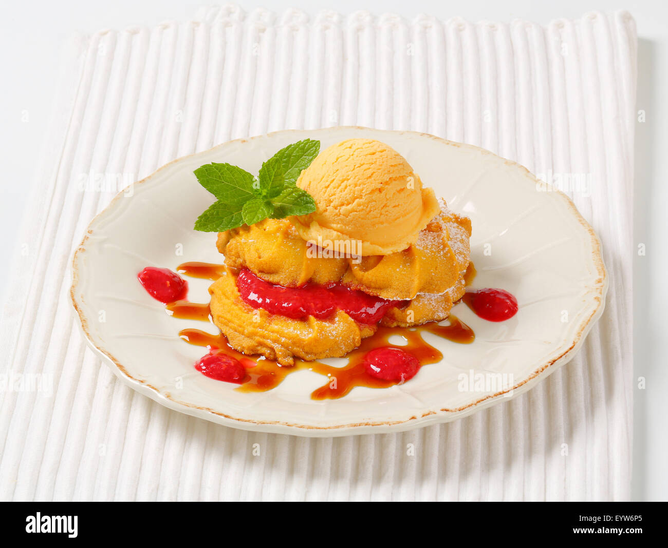 Spritz cookies with raspberry sauce and ice cream Stock Photo - Alamy