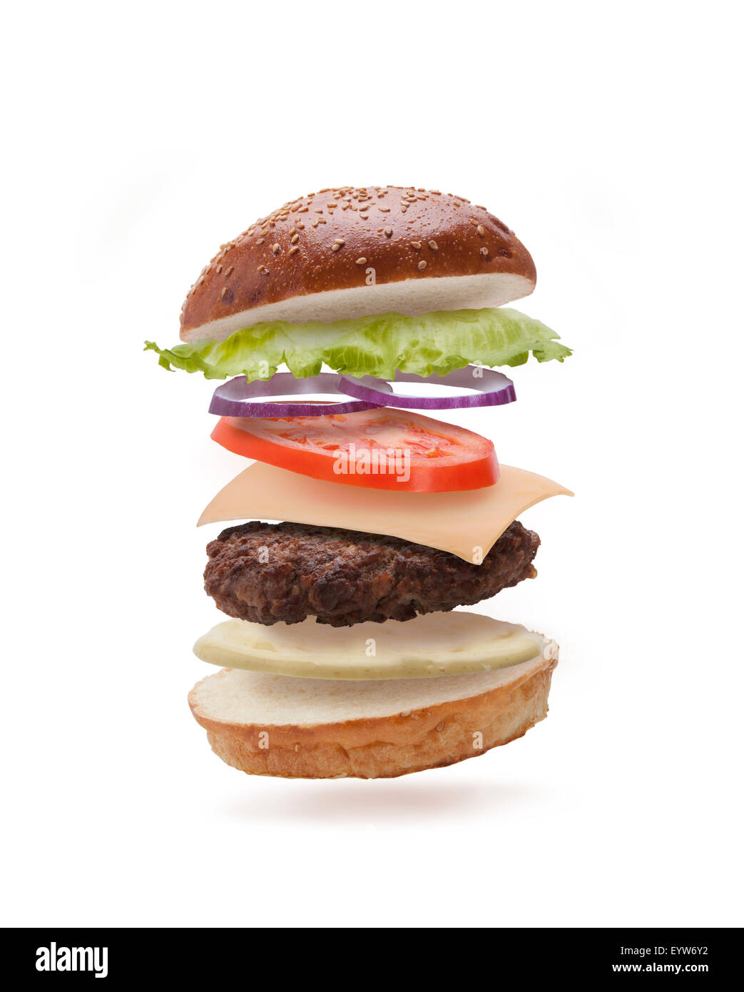 delicious burger with flying ingredients on white background Stock ...