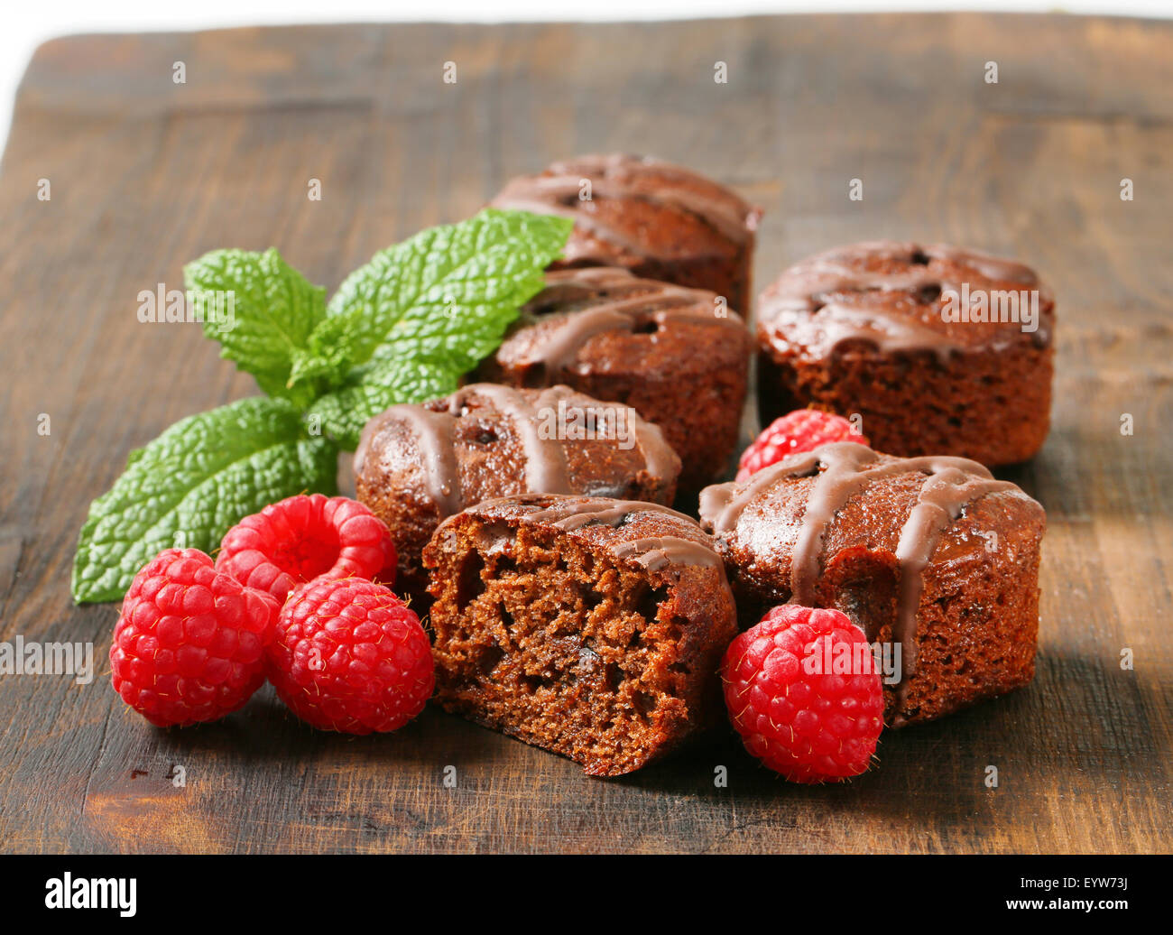 Mini chocolate cakes with raspberry filling Stock Photo - Alamy