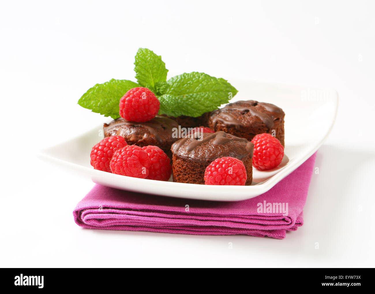 Mini chocolate cakes with raspberry filling Stock Photo - Alamy