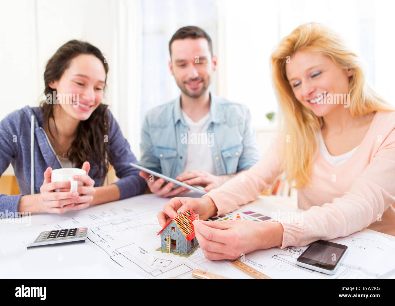 View of Architect students finalysing their house construction project ...