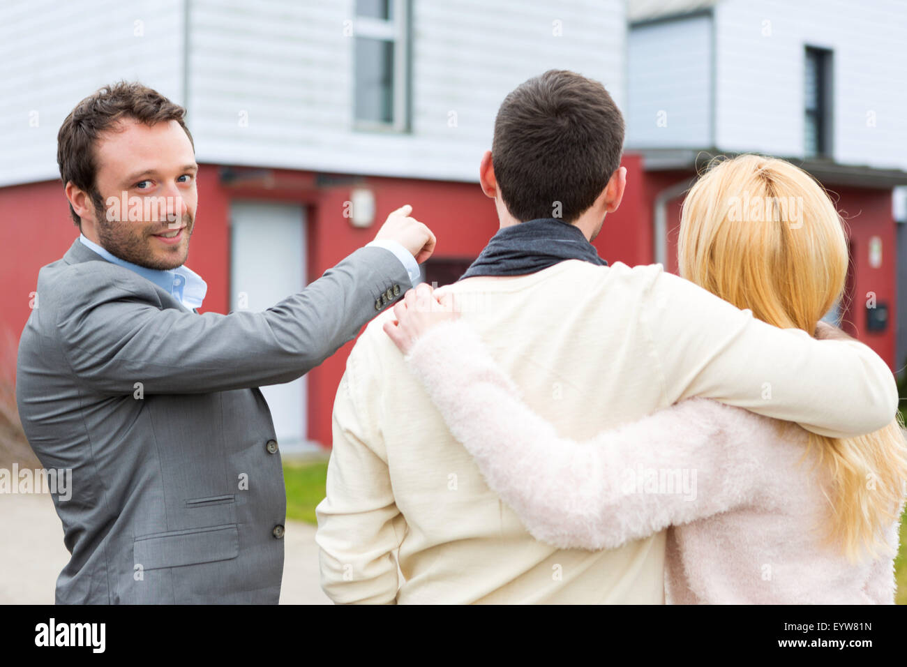View of a Real estate agent shows details to customers Stock Photo - Alamy