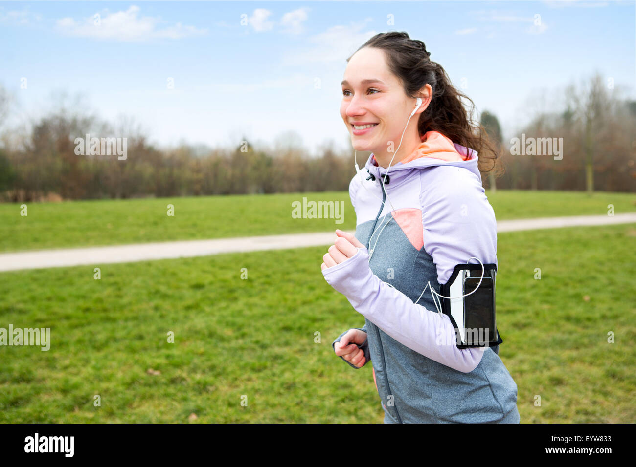 Healthy woman running green park hi-res stock photography and images ...