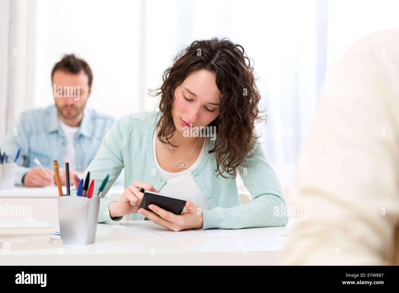 View of a Young attractive student taking mathematics exams Stock Photo ...