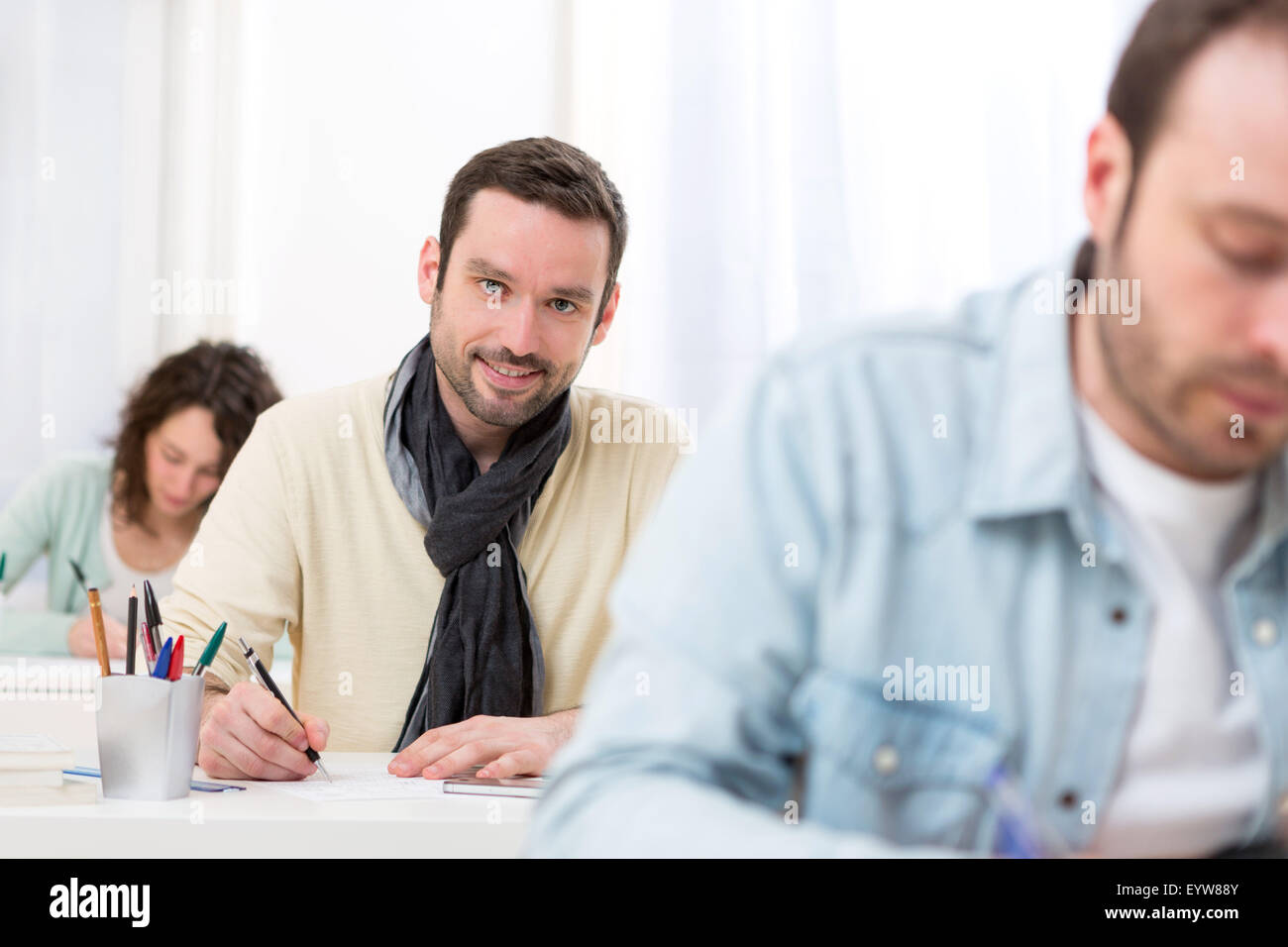 View of a Young attractive man taking competitive exam Stock Photo - Alamy