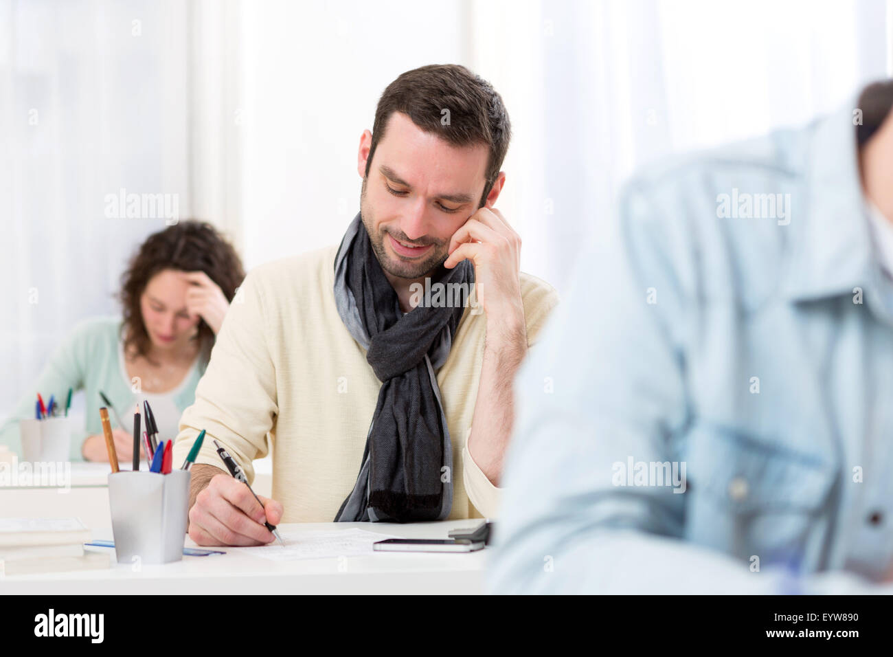 View of a Young attractive man taking competitive exam Stock Photo - Alamy