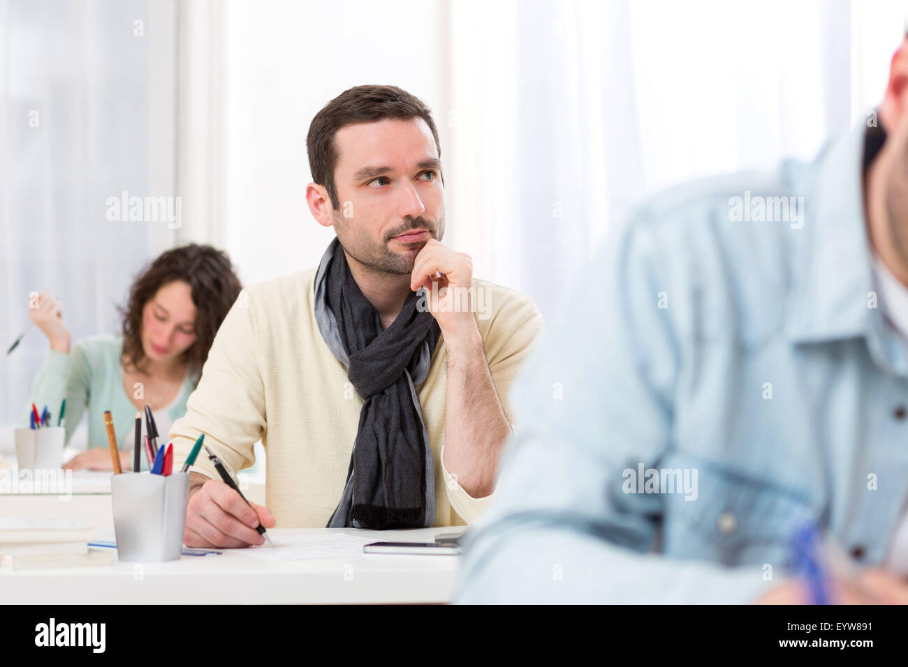 View of a Young attractive man taking competitive exam Stock Photo - Alamy