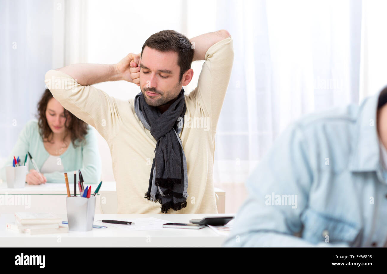 View of a Young attractive student stretching during classes Stock ...