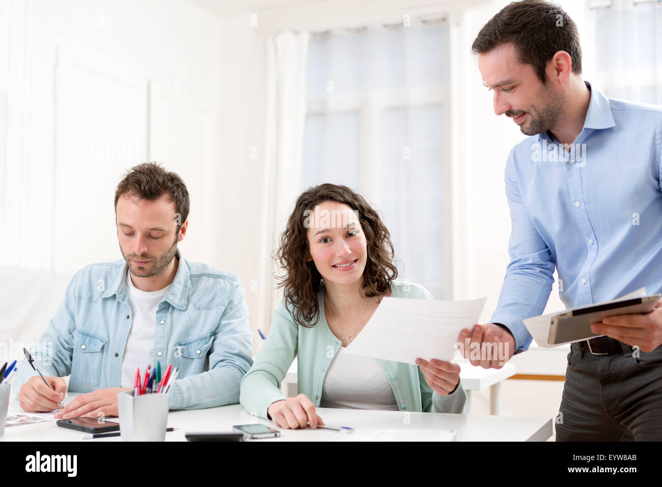 View of Two interns working together assisted by their course ...