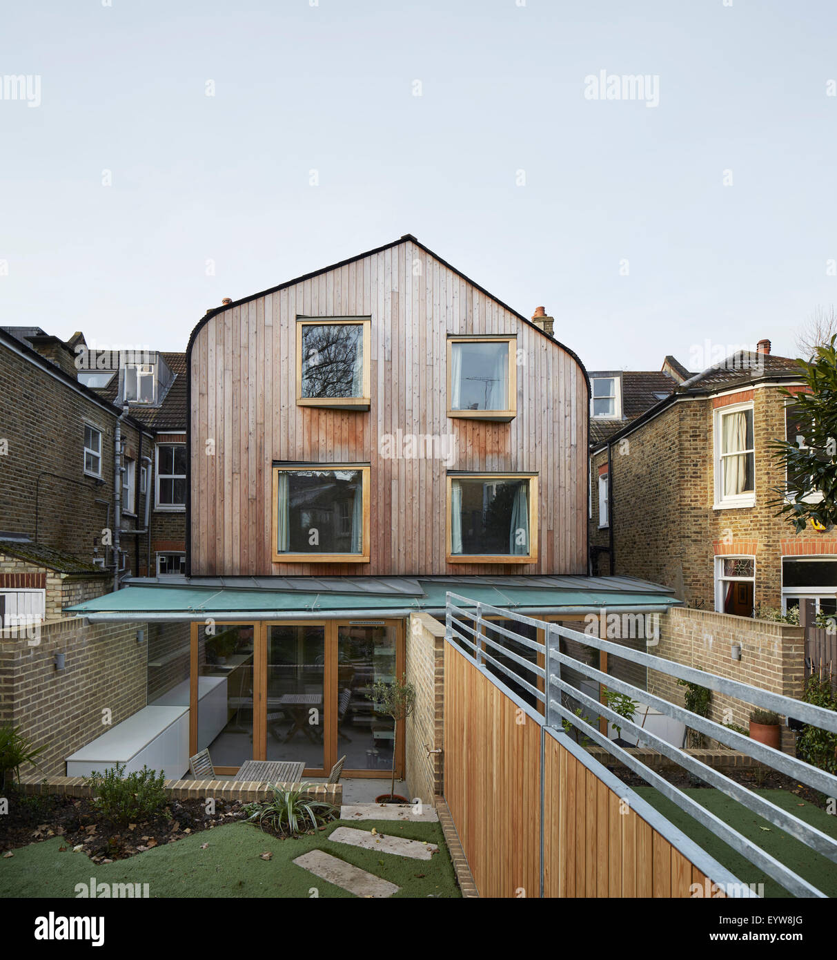 Distant elevation from garden towards canopied courtyard and doors ...