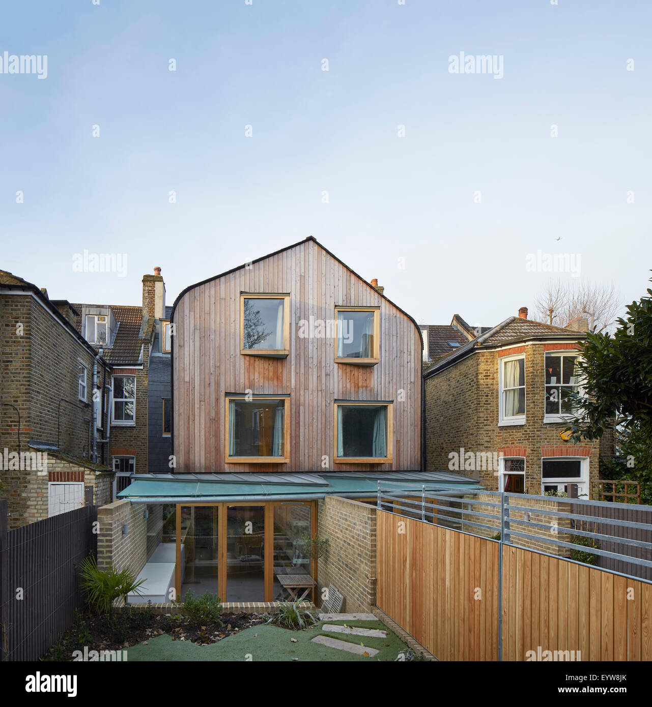 Distant elevation from garden towards canopied courtyard and doors ...