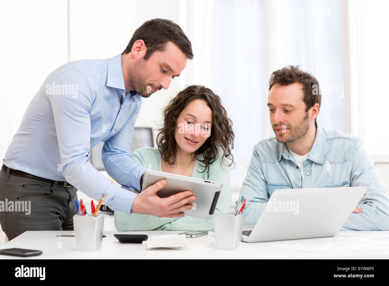 View of Two interns working together assisted by their course ...