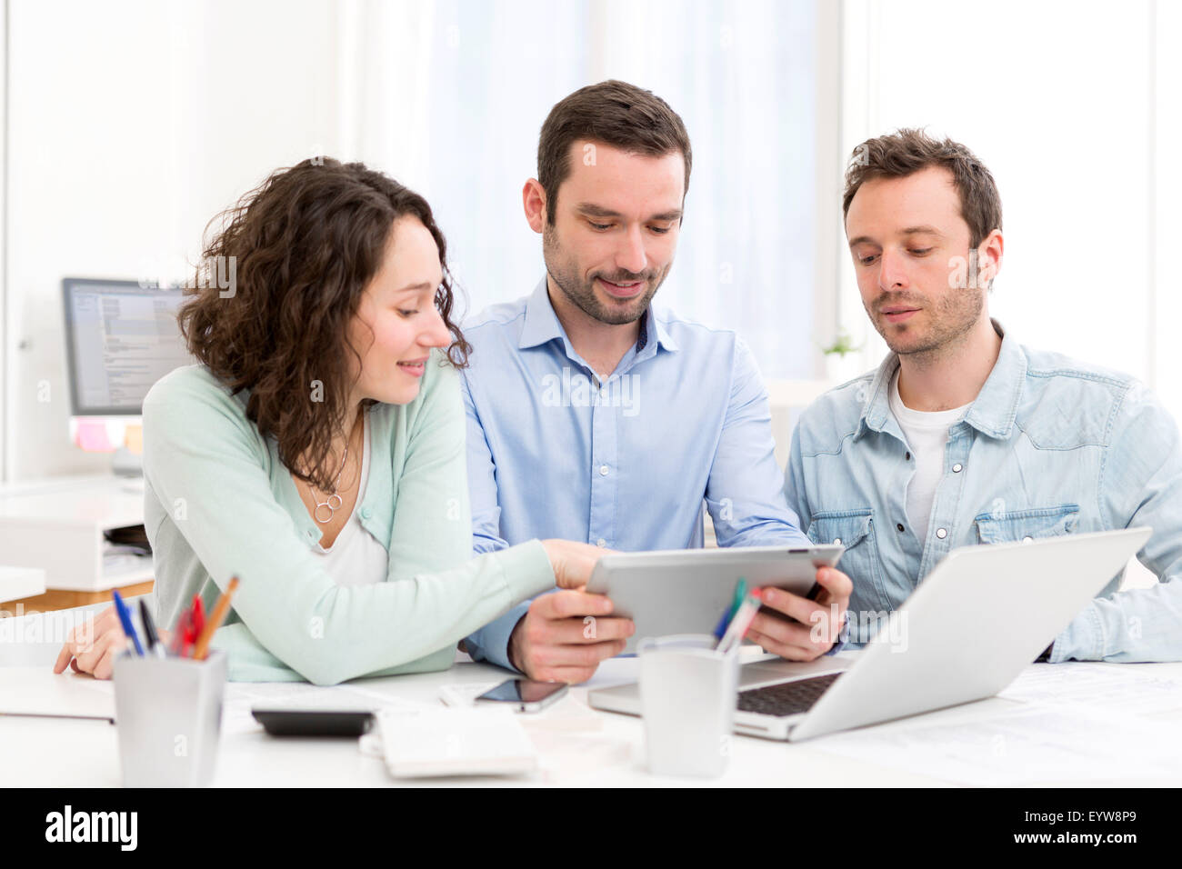 View of Two interns working together assisted by their course ...