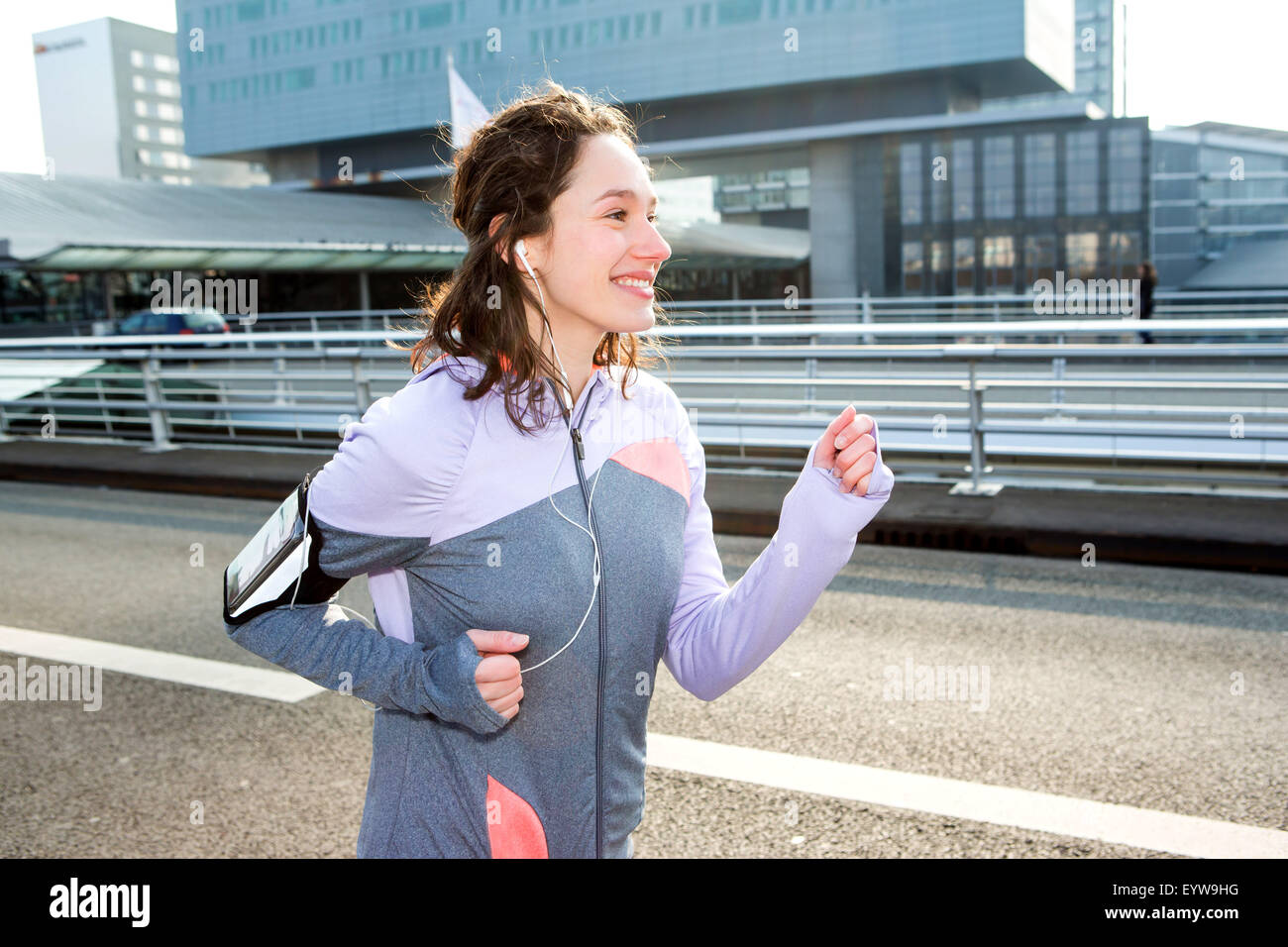 View of a Young attractive woman running downtown Stock Photo - Alamy