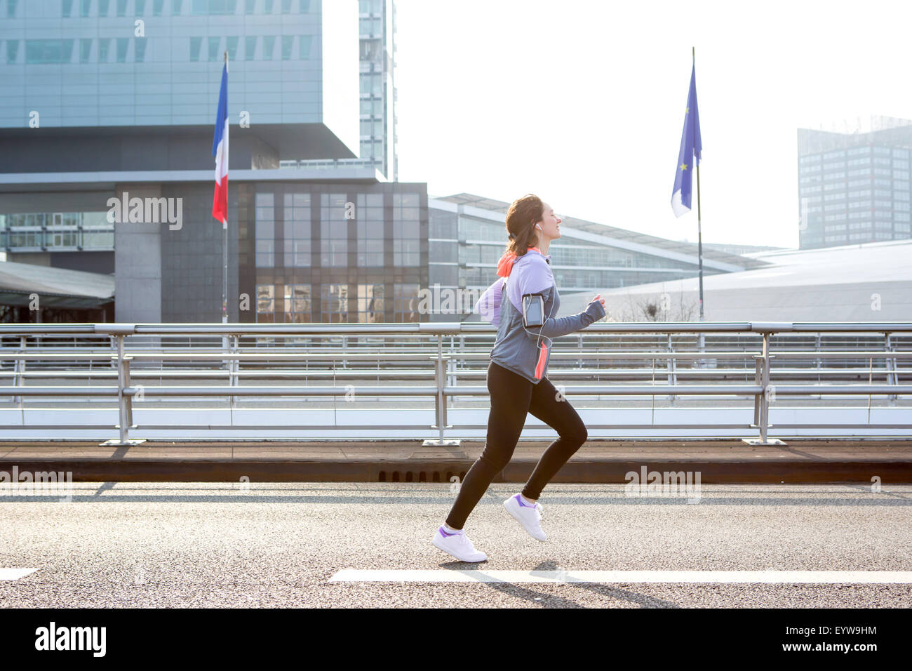 View of a Young attractive woman running downtown Stock Photo - Alamy