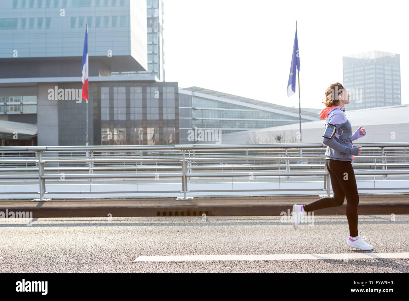 View of a Young attractive woman running downtown Stock Photo - Alamy