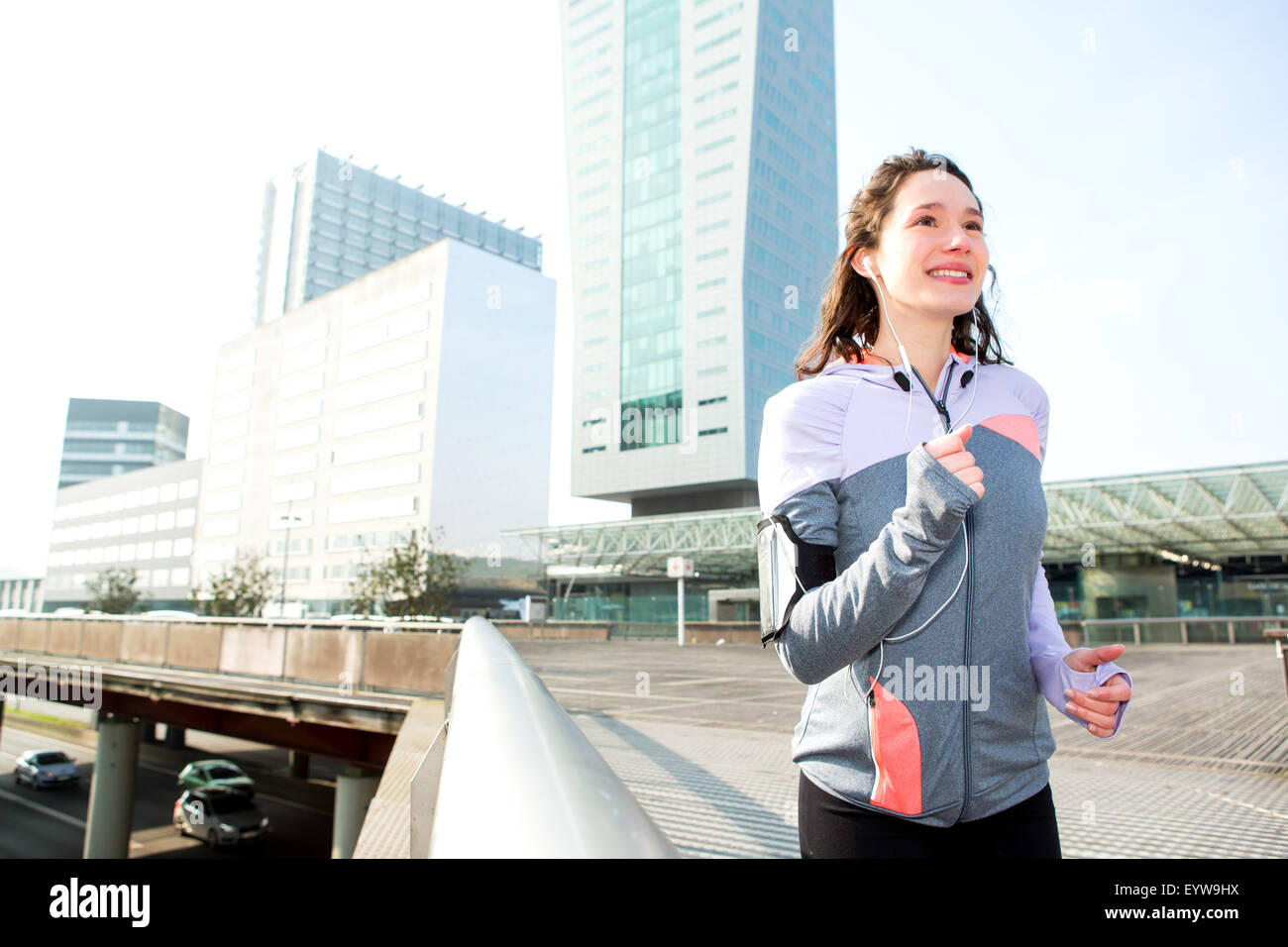 View of a Young attractive woman running downtown Stock Photo - Alamy