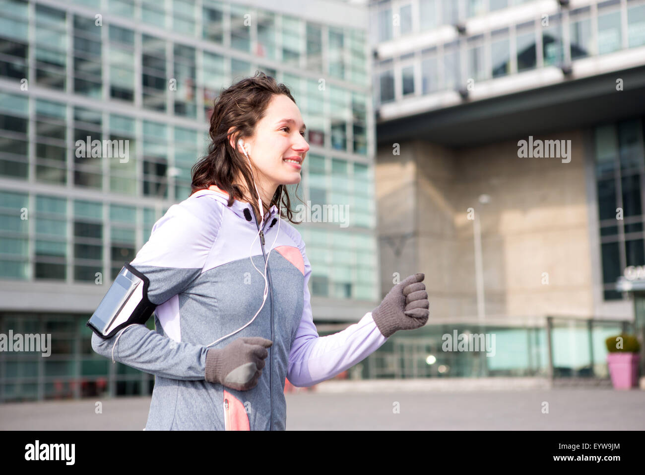 View of a Young attractive woman running downtown Stock Photo - Alamy