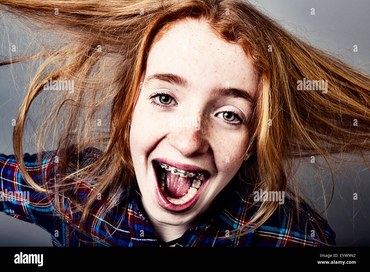 Naughty screaming red-haired girl, portrait Stock Photo - Alamy