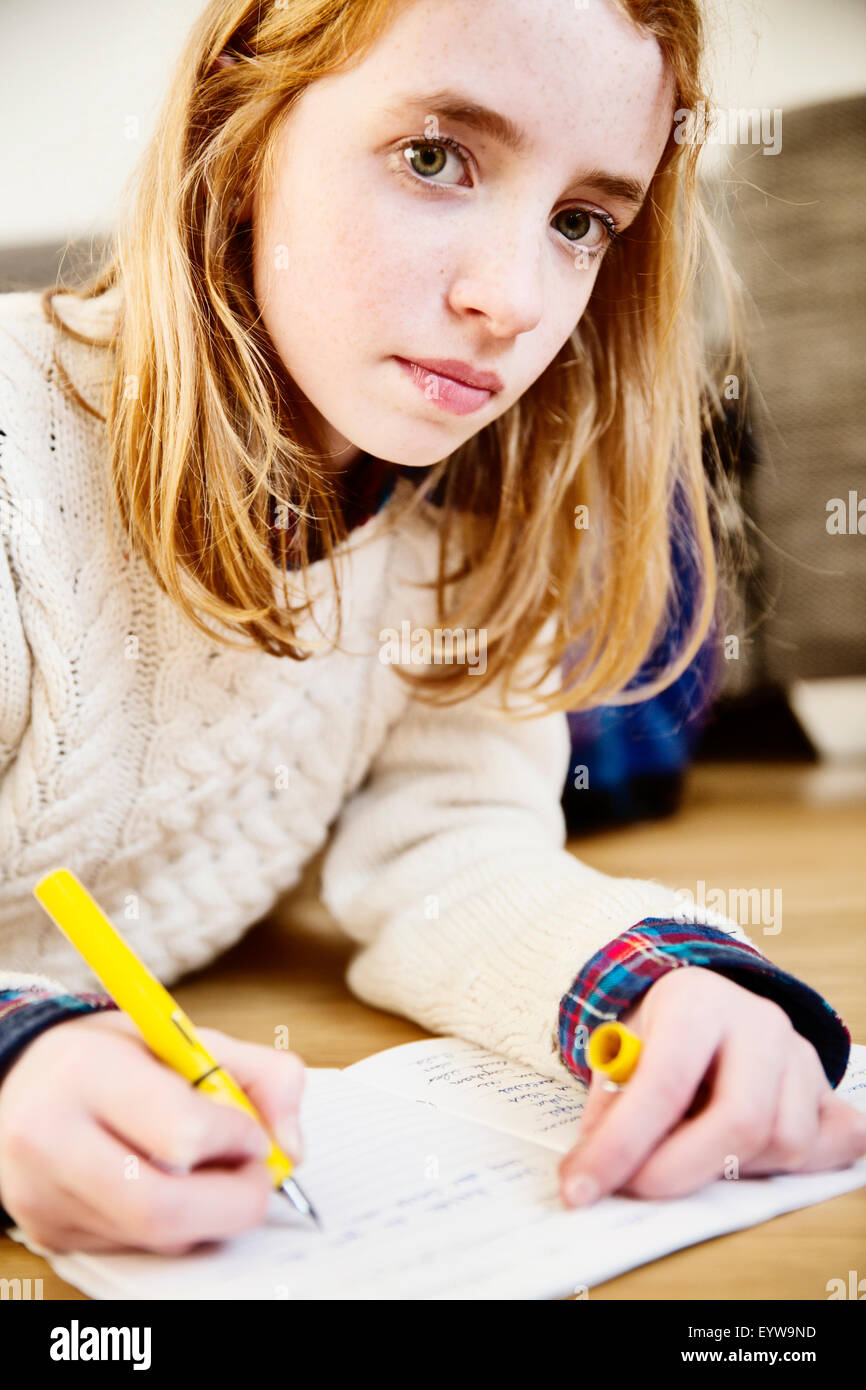 Hand doing homework hi-res stock photography and images - Alamy