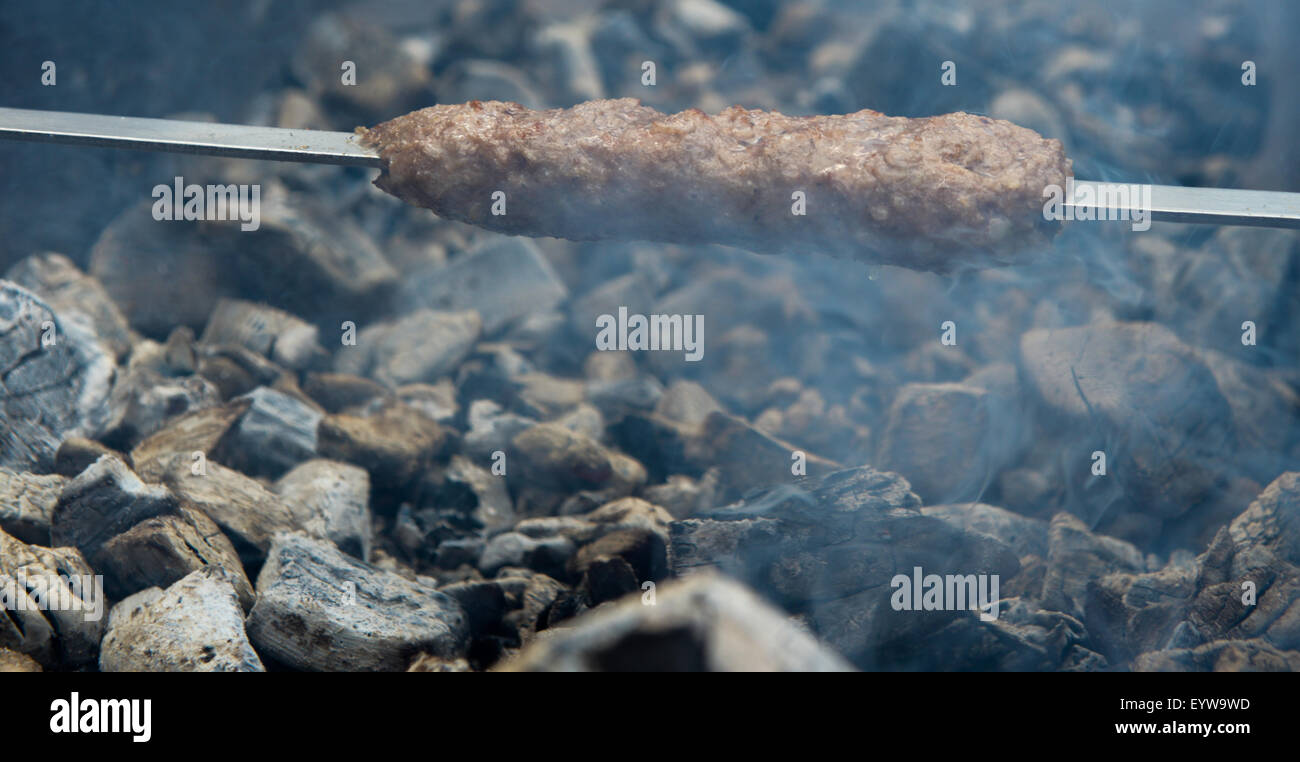 cooking meat on the hot steaming coals Stock Photo - Alamy