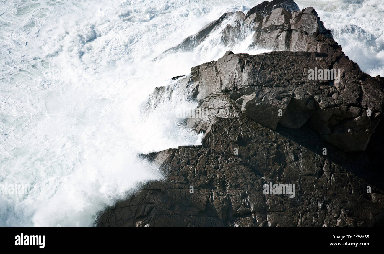 Cliffs at Cabo da Roca (Cape Roca) and ocean waves splashing on rocks ...
