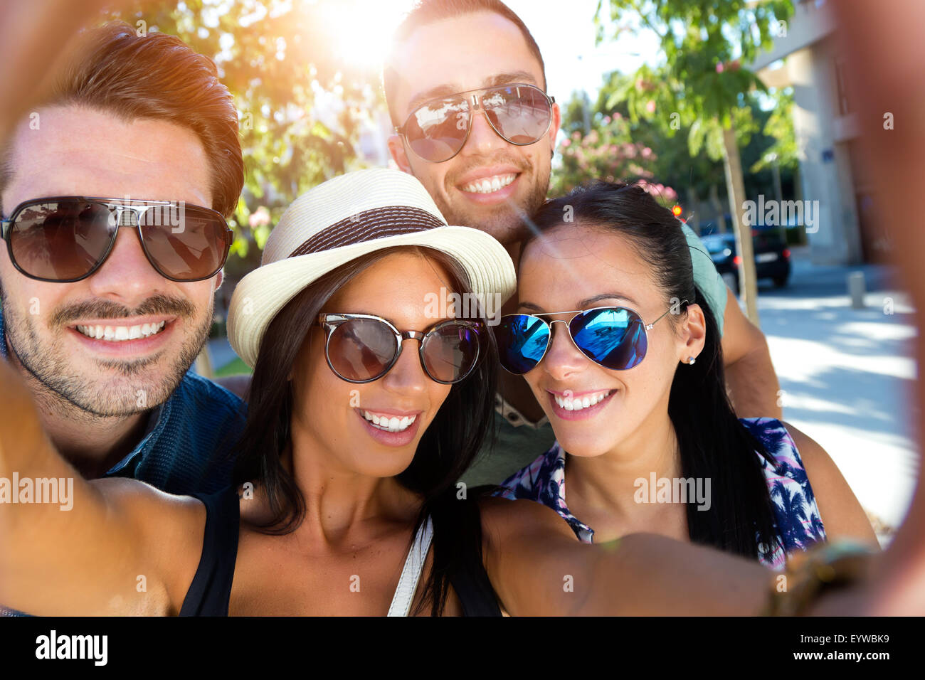 Outdoor portrait of group friends taking photos with a smartphone Stock ...