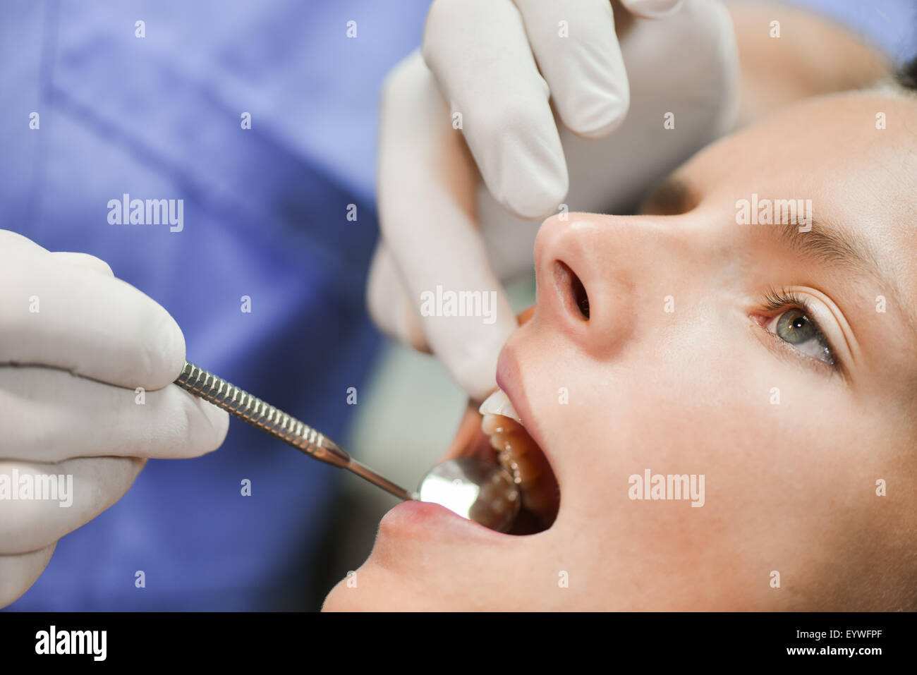 Woman undergoing dental procedure Stock Photo - Alamy