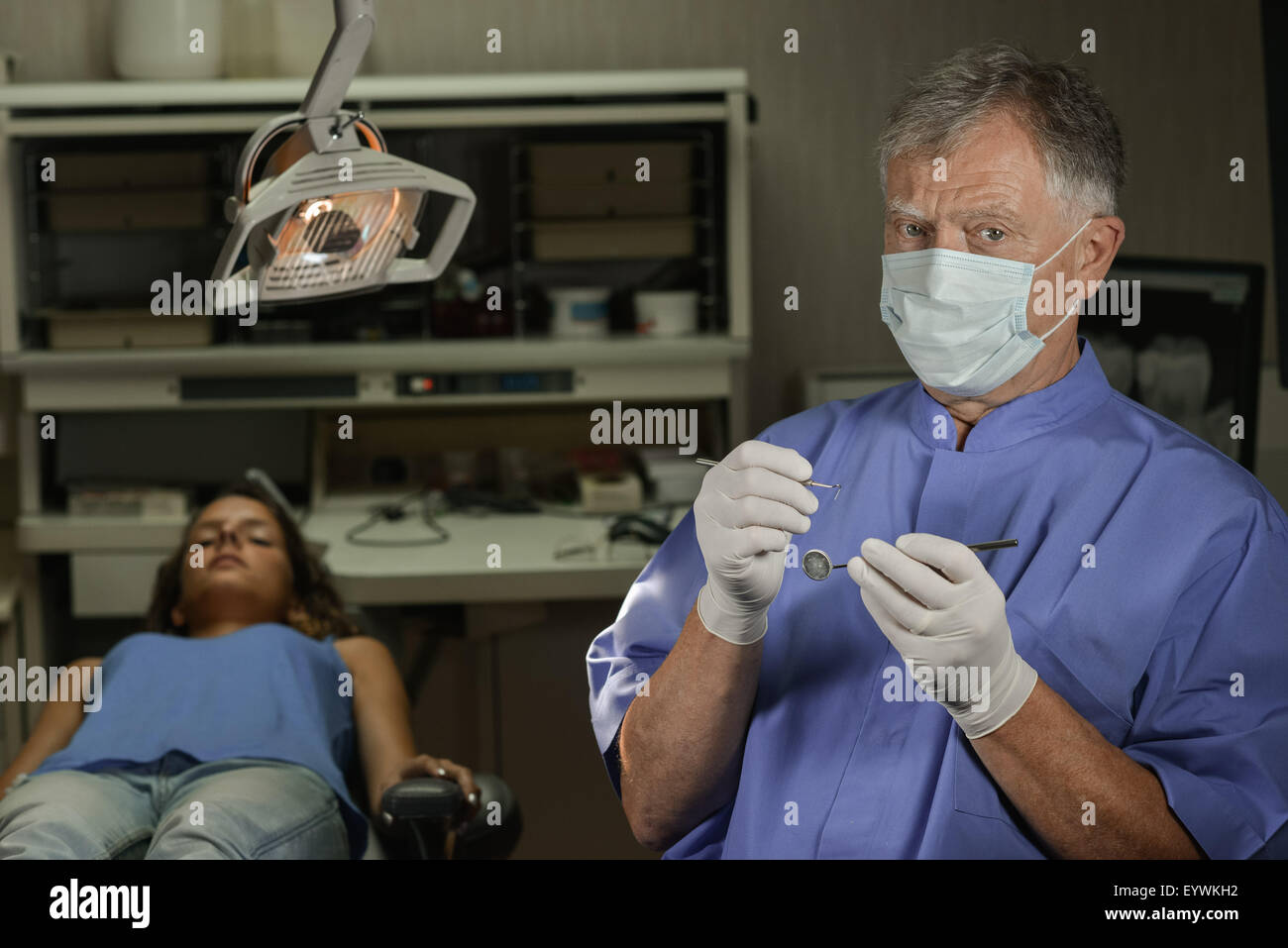 Dentist doing dental examination Stock Photo - Alamy