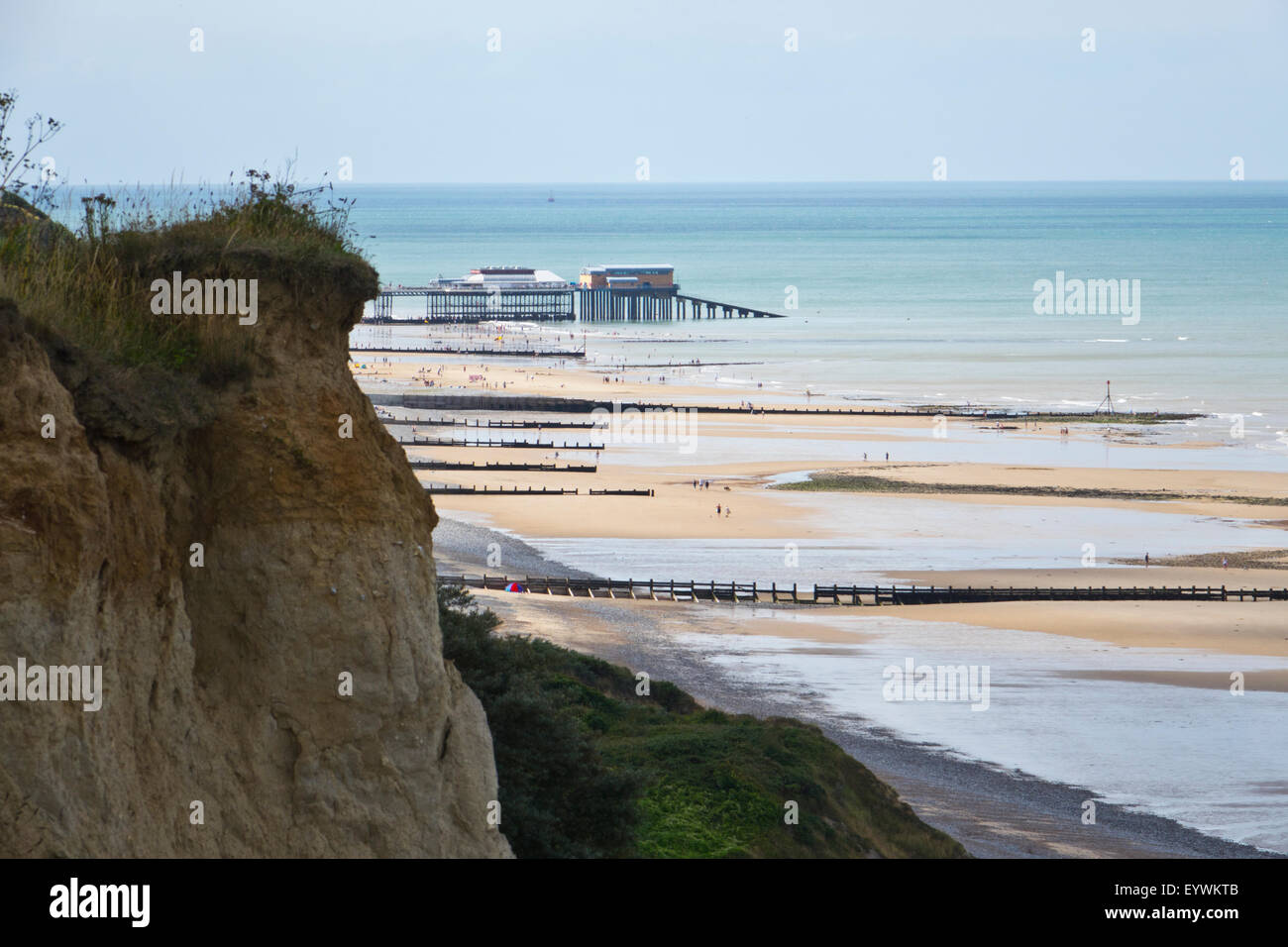 Cliffs and beach pier Stock Photo - Alamy