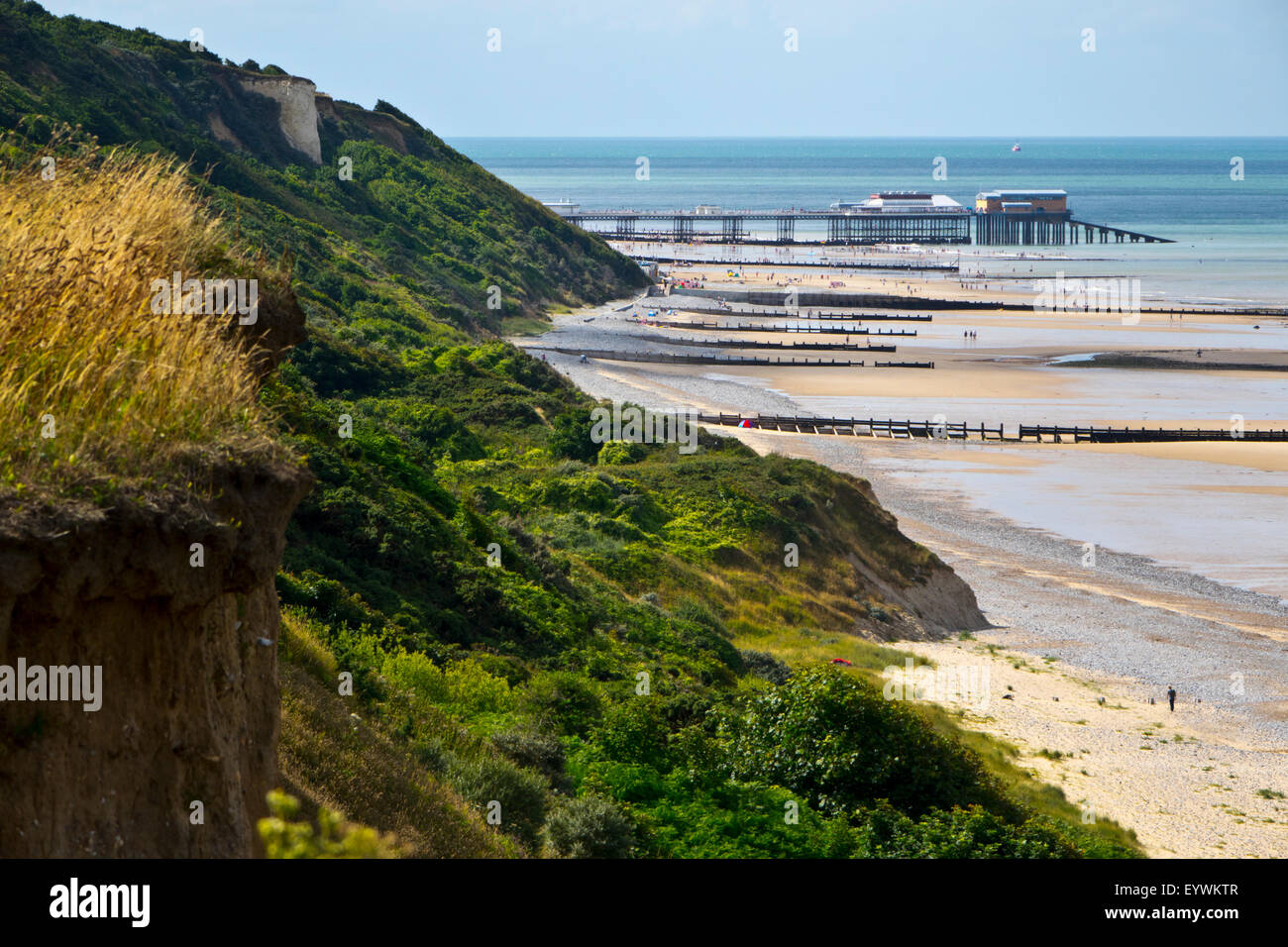 Cliffs and beach pier Stock Photo - Alamy
